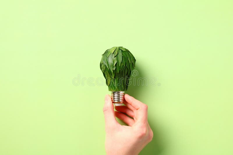 Female Hand with Eco Saving Light Bulb. Green Energy Concept Stock ...