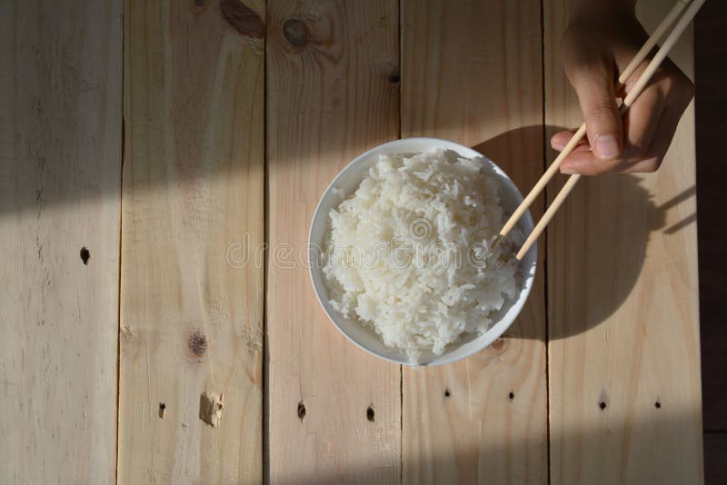 Female Hand Hold Rice in White Bowl Stock Photo - Image of rice, nature ...
