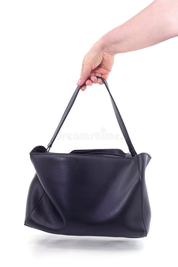 Female hand holding a bag stock photo. Image of background - 307034378