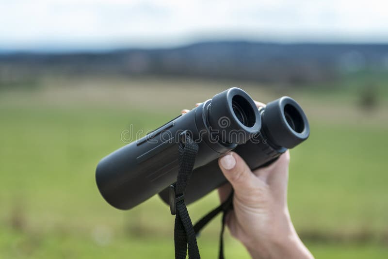 Female Hand Holding a Binoculars . Stock Photo - Image of equipment ...