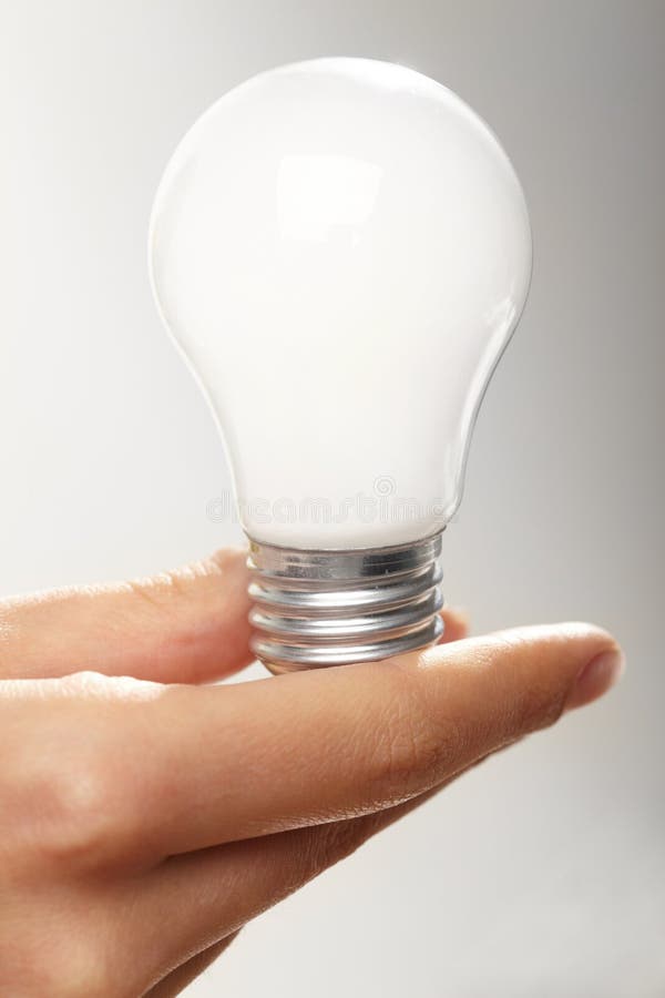 Female hand holding bulb stock image. Image of detail - 18674021