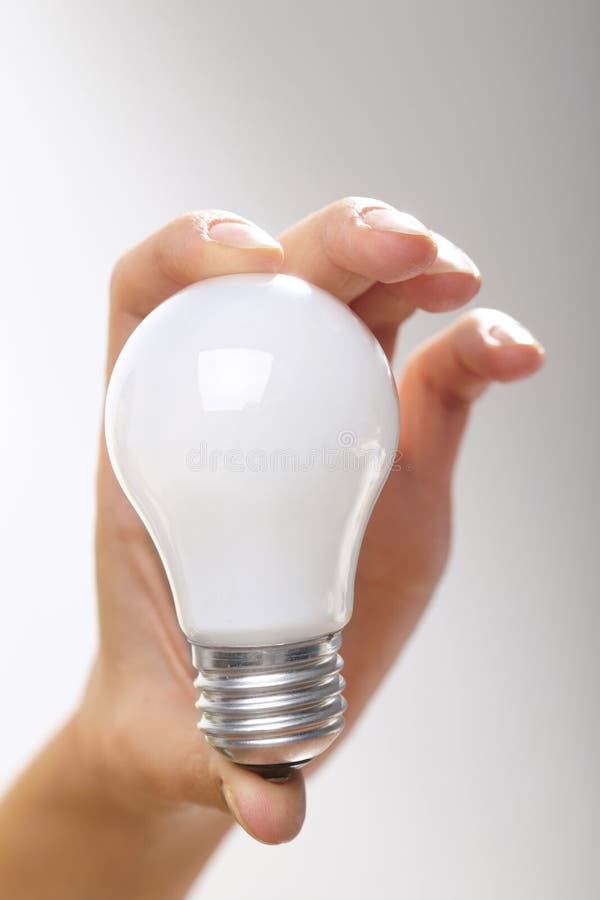 Female hand holding bulb stock image. Image of improvement - 18674041