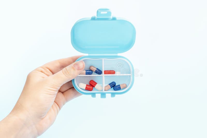 Female Hand Holding Capsules in Pill Box Close-up Top View. Stock Photo ...