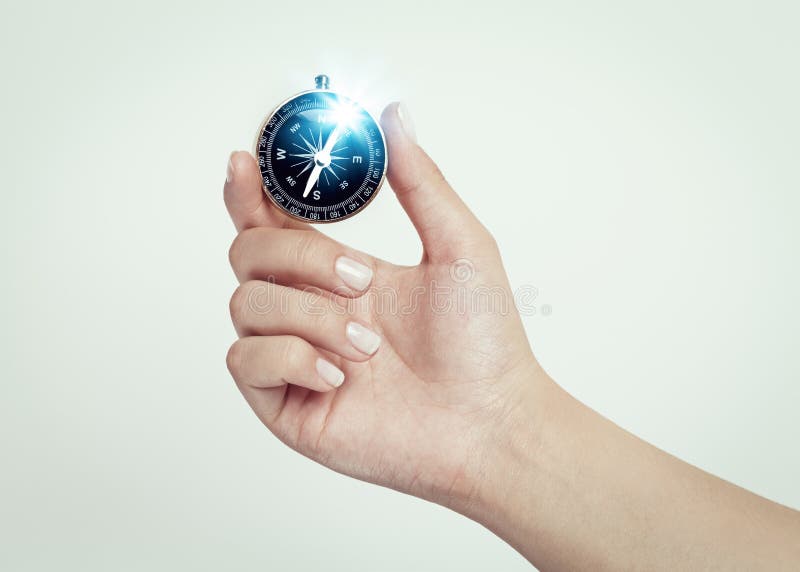 Female Hand Holding Compass Stock Image - Image of metal, explore: 63750867