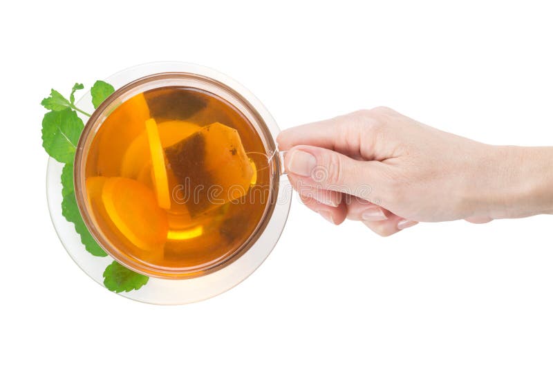 Female Hand Holding a Cup of Tea Stock Photo - Image of yellow, macro ...