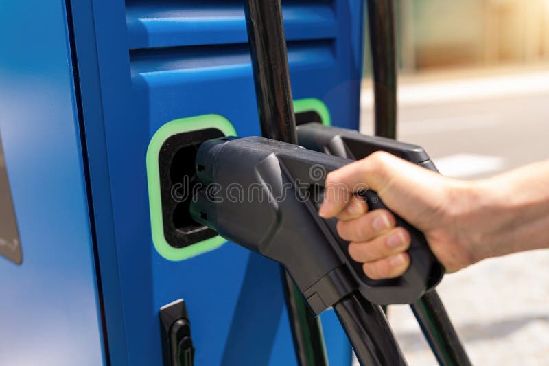 Female Hand Holding Fast Charging Socket DC - CCS Type 2 EV. Combined ...