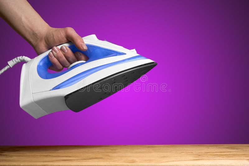 Female Hand Holding a Hot Iron Stock Photo - Image of metallic, holding ...