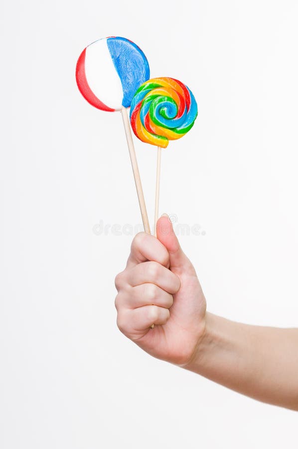 752 Hand Holding Lollipop Blue Background Stock Photos - Free & Royalty ...