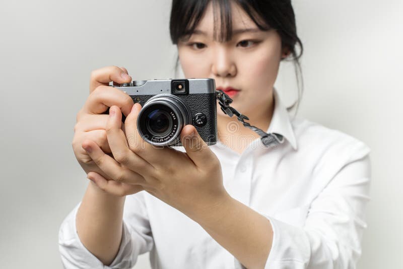 Female Hand Holding Modern Camera Mirrorless Camera. Camera in Hand ...