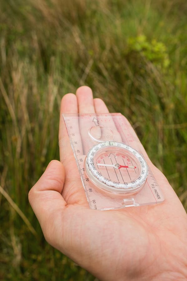 Female Hand Holding Modern Compass Showing the Way Stock Image - Image ...