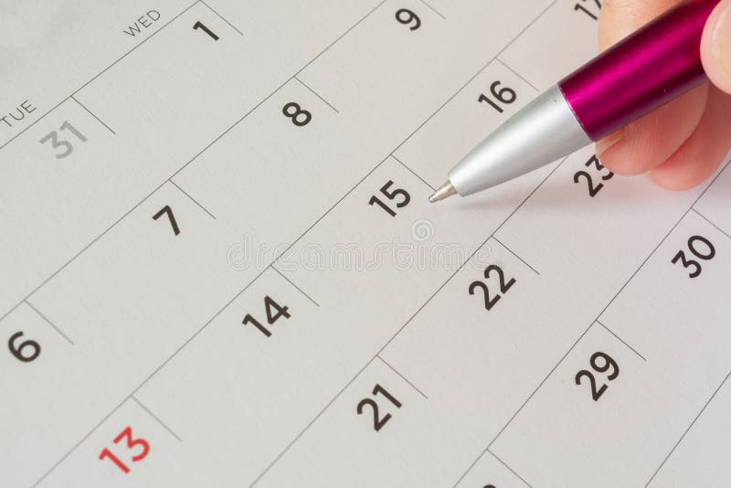 Female Hand Holding Pen with Calendar Page Stock Photo - Image of ...