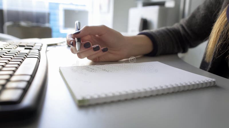 Female Hand Holding Pen, Taking Notes in Her Notebook, Searching for ...