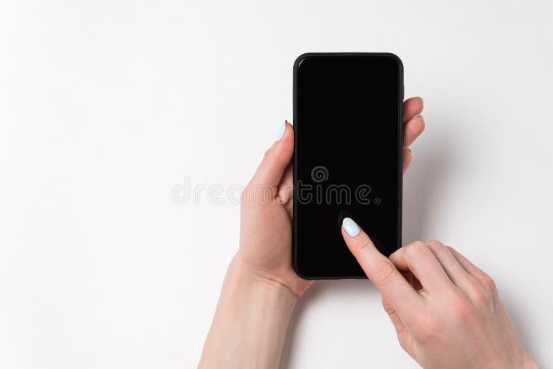 Female Hand Holding Phone with Empty Screen. Finger on Display Stock ...