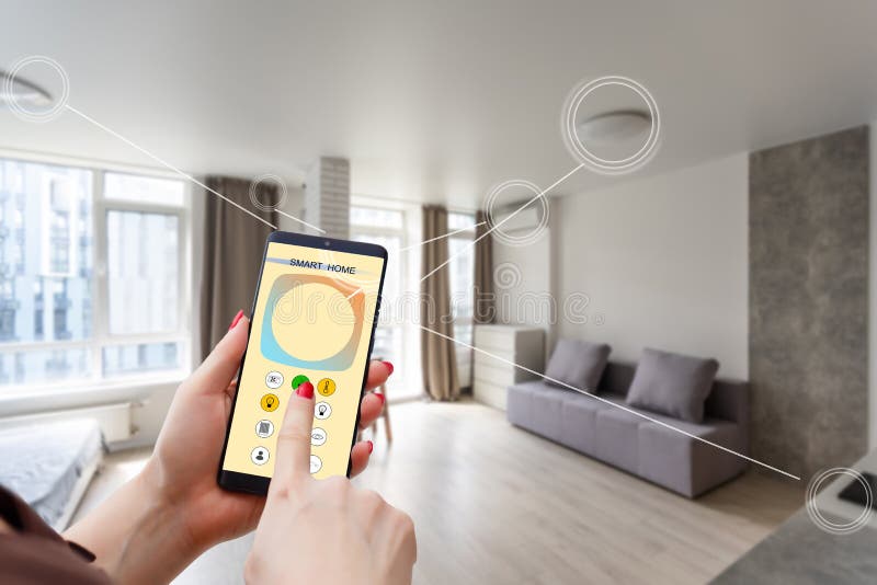 Female Hand Holding Phone with Smart Home on the Screen in the Room ...