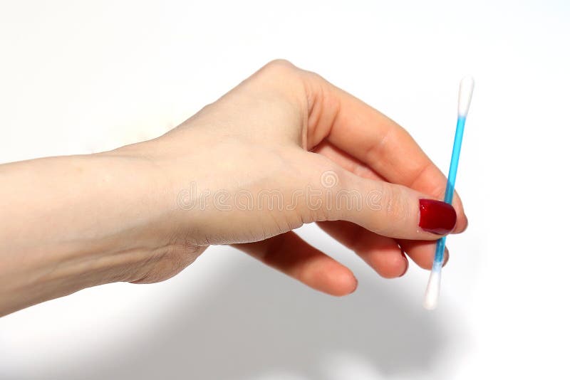 Female hand holding Q-tip stock photo. Image of hygienic - 267009010