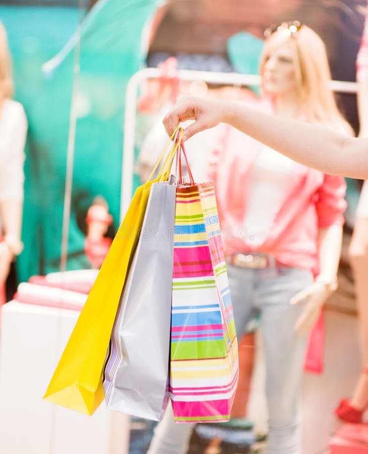 Female Hand Holding Shopping Bags Stock Image - Image of mall, card ...