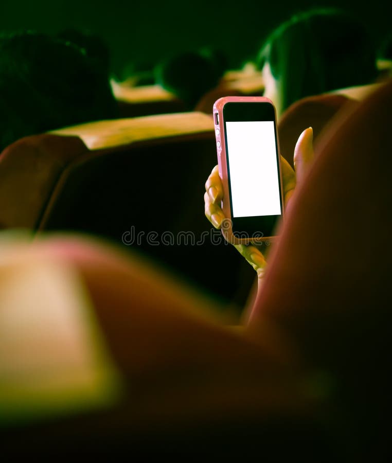 Female Hand Holding Smartphone while Watching a Cinema Stock Photo ...
