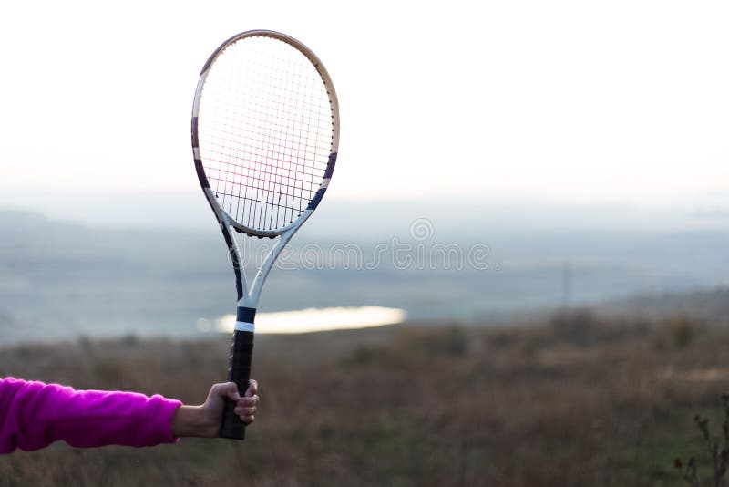 Female Hand Holding Tennis Racket Outdoors. Stock Photo - Image of ...