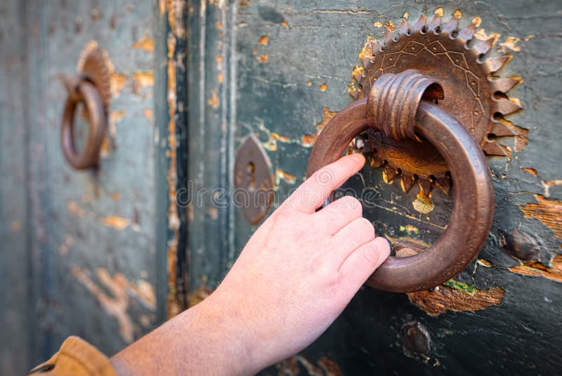 Female Hand Holding on To the Ring of an Old Medieval Door Stock Photo ...