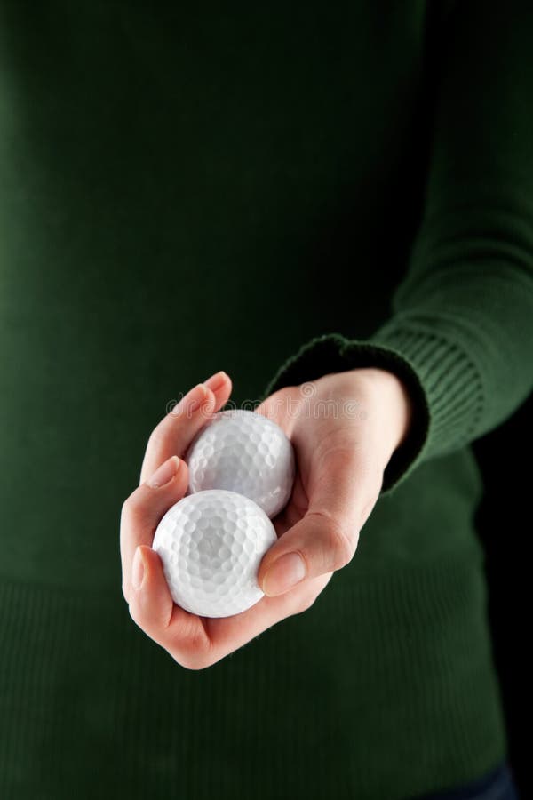 Female Hand Holding Two Golf Balls Stock Image - Image of white ...