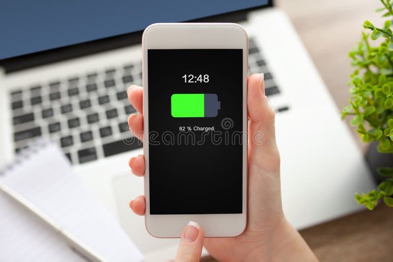 Female Hand Holding White Phone with Charged Battery on Screen Stock ...