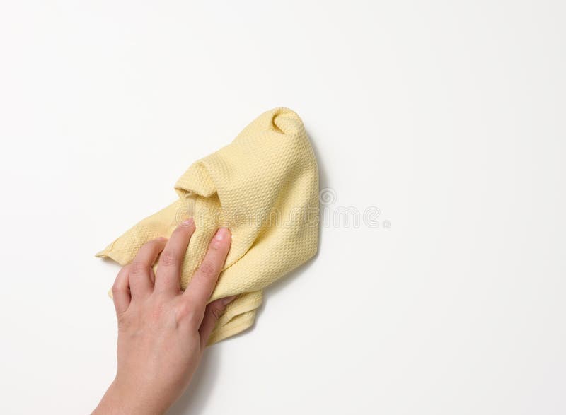 Female Hand Holding a Yellow Rag on a White Background Stock Image ...