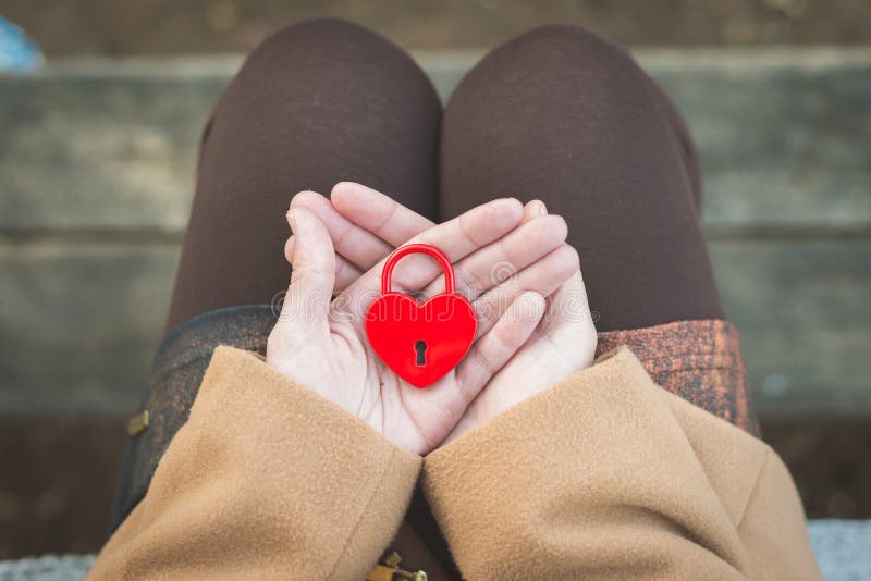 Female Hand Holds Closed Red Padlock Stock Photo - Image of girl, hand ...