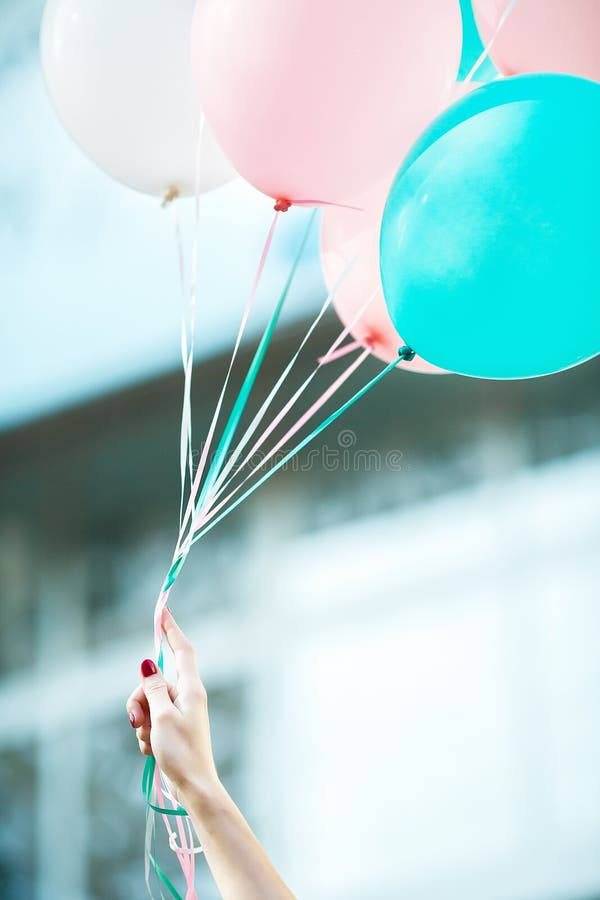 Female Hand Holds Flying Balloons Stock Image - Image of lady, holiday ...