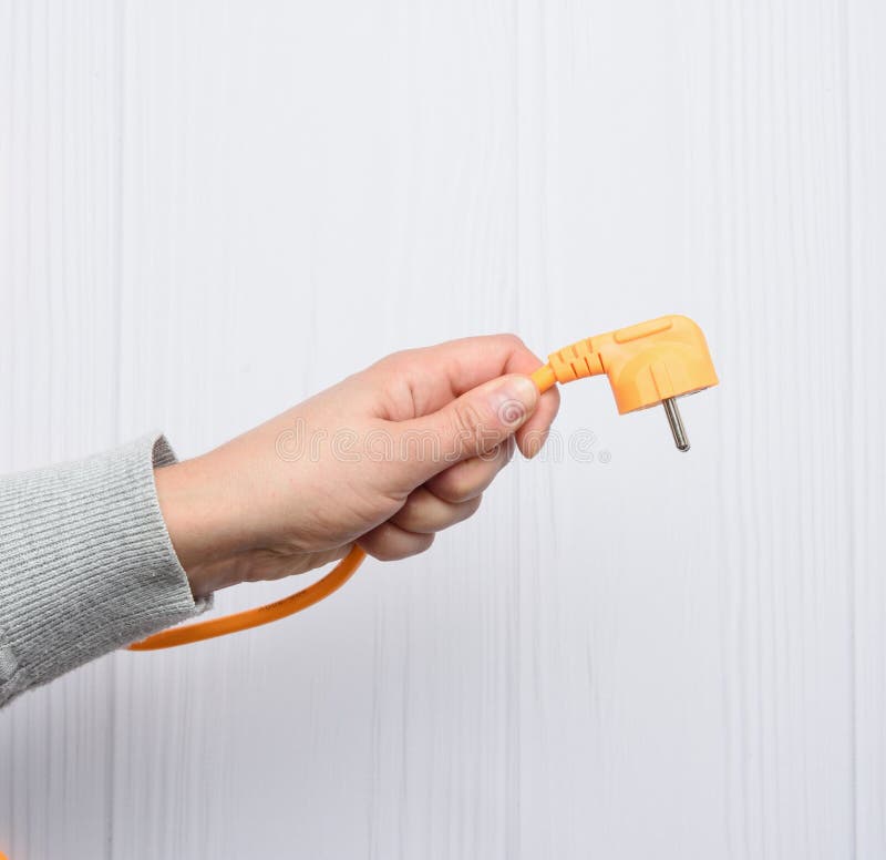 Female Hand Holds Orange Cable with Plug for Socket Stock Image - Image ...