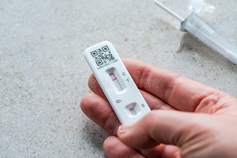 Female Hand Holds Rapid Lateral Flow Test Device Stock Photo - Image of ...