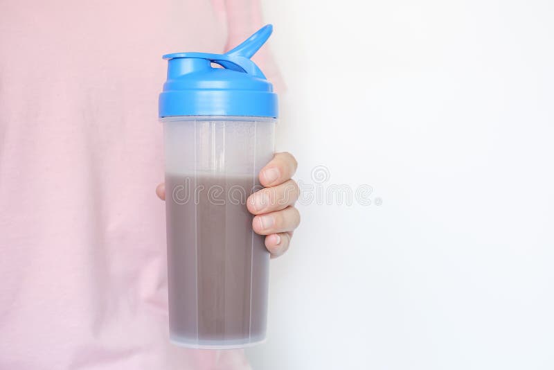 Female Hand Holds Shaker with Protein Shake on White Background. Stock ...