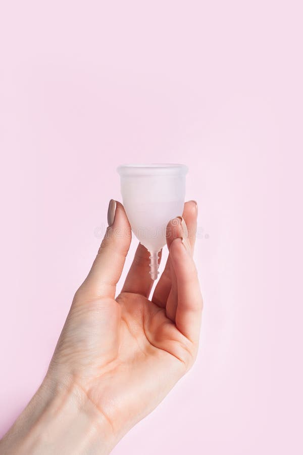 Female Hand Holds Silicone Menstrual Cup. Reusable Intimate Hygiene ...