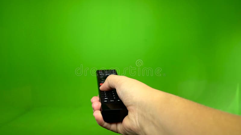 Female Hand Operating a Tv Remote Control on a Green Screen Stock Video ...