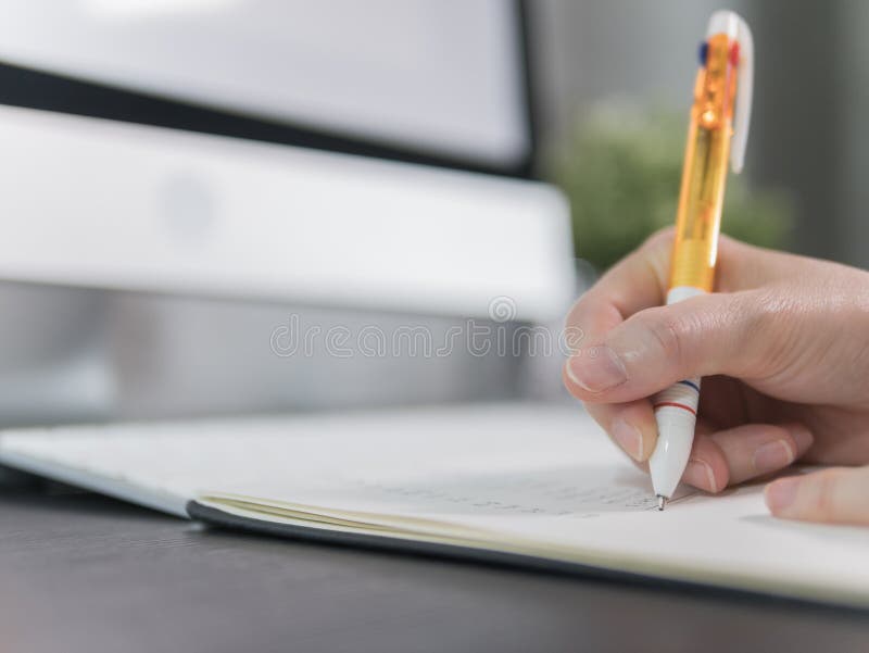 Female Hand with Pen Writing Notes on Table in Office Stock Photo ...