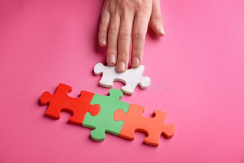 Female Hand with Pieces of Puzzle on Color Background Stock Image ...