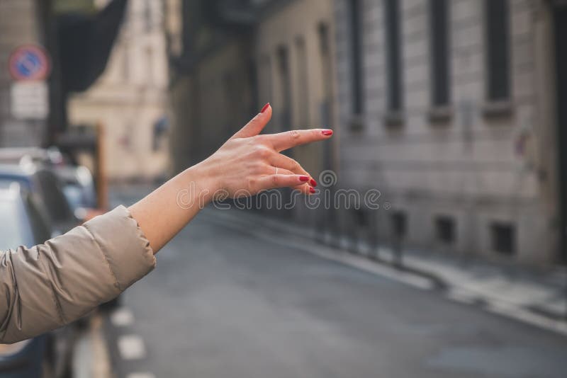 Female Hand Pointing in the City Streets Stock Photo - Image of nails ...