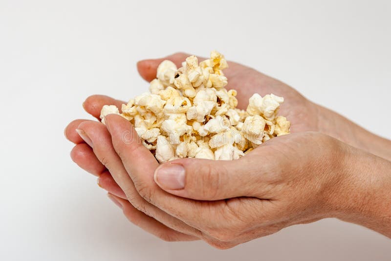 Hand with popcorn stock image. Image of salted, delicious - 23910213