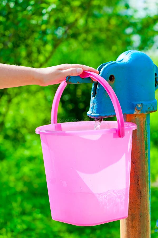Female Hand Pours Water on Column in a Bucket Stock Image - Image of ...