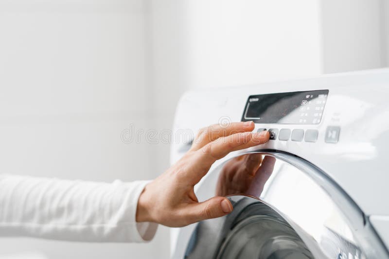 Female Hand Press Button on Washing Machine Indoors Stock Image - Image ...