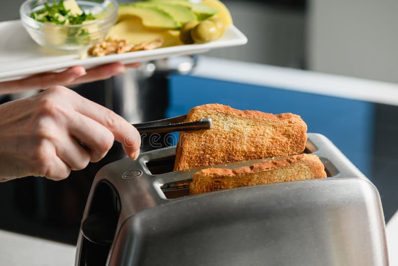 Toaster with Toasted Bread for Breakfast Inside Stock Photo - Image of ...