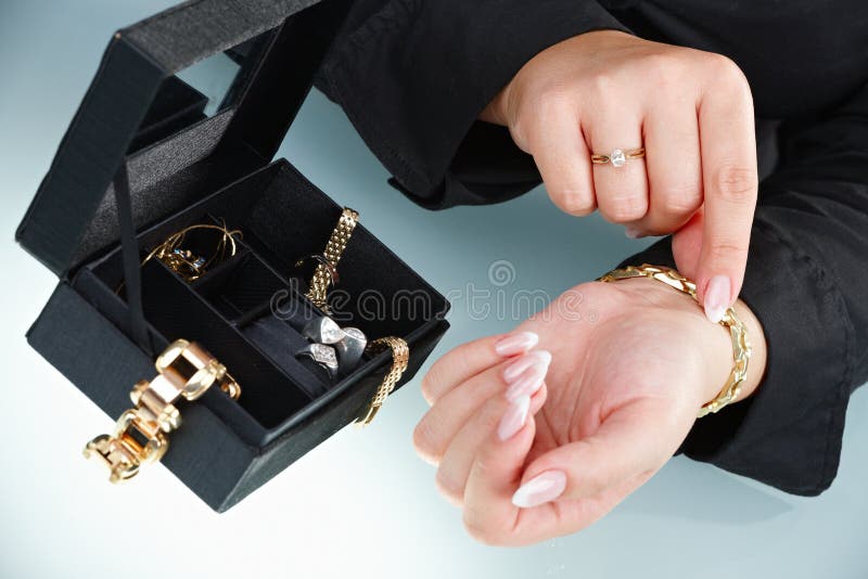 Female Hand Putting Up Bracelet Stock Image - Image of body, putting ...