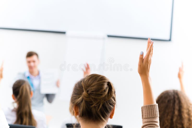 Female Hand Raised in Class Stock Photo - Image of casual, hand: 39086356