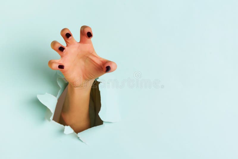 Female Hand Reaching Torn Paper Sheet Stock Photos - Free & Royalty ...