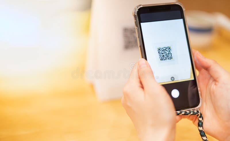 Female Hand Scanning the QR Code with Mobile Phone for Order Foods and ...