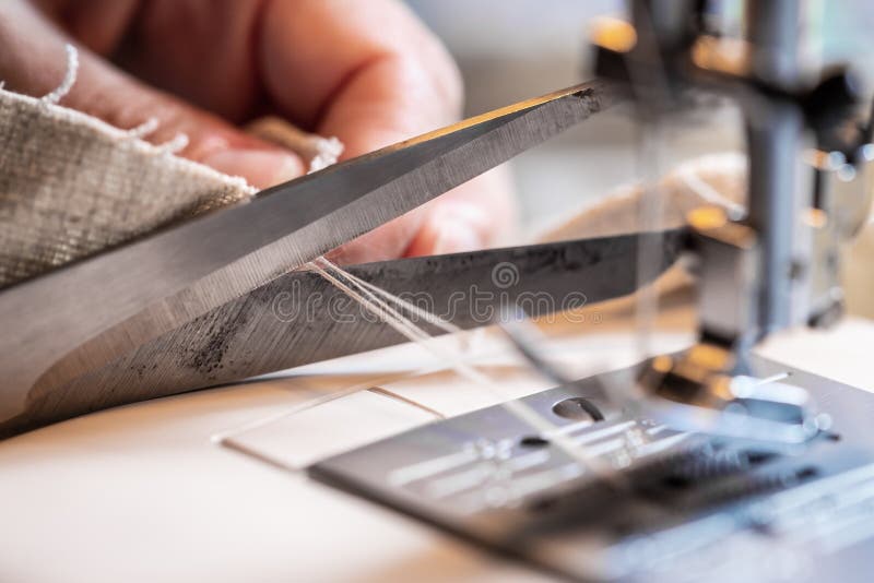 Scissors is Cutting a Thread at His Sewing Machine Stock Photo - Image ...
