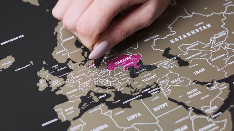 Female Hand Scratching the Surface of a Scratch Map with Poland Country ... Female Hand Scratching the Surface of a Scratch Map with Poland Country ...