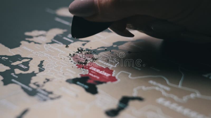 Female Hand Scratching the Surface of a Scratch Map with Poland Country ... Female Hand Scratching the Surface of a Scratch Map with Poland Country ...