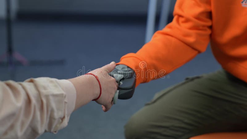 A Female Hand Shakes a Robotic Hand. a Female Hand Shakes a Robotic ...