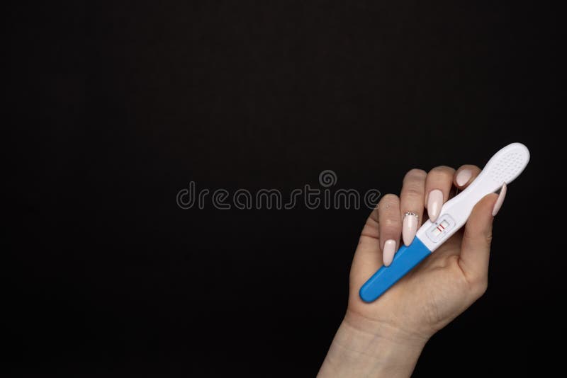 Female Hand Showing Positive Pregnancy Test Stock Image - Image of ...