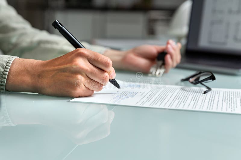 Female Hand Signing an Agreement in the Office Stock Image - Image of ...